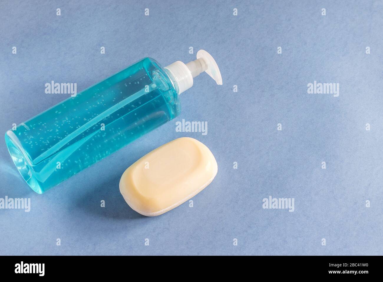 Antibacterial liquid sanitizer and disinfection soap on the blue ...