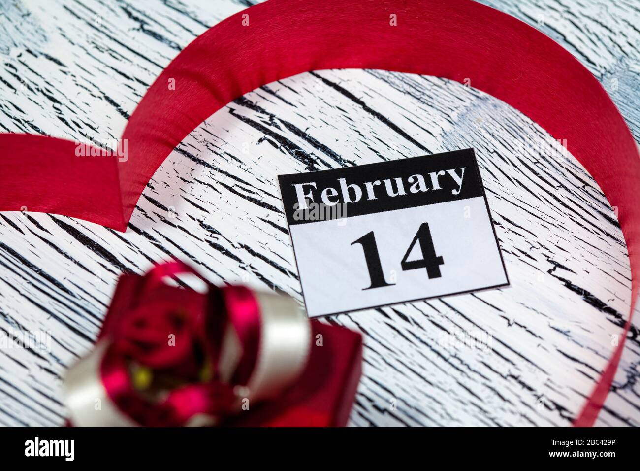 February 14, on the calendar, Valentine's day, heart from red ribbon ...