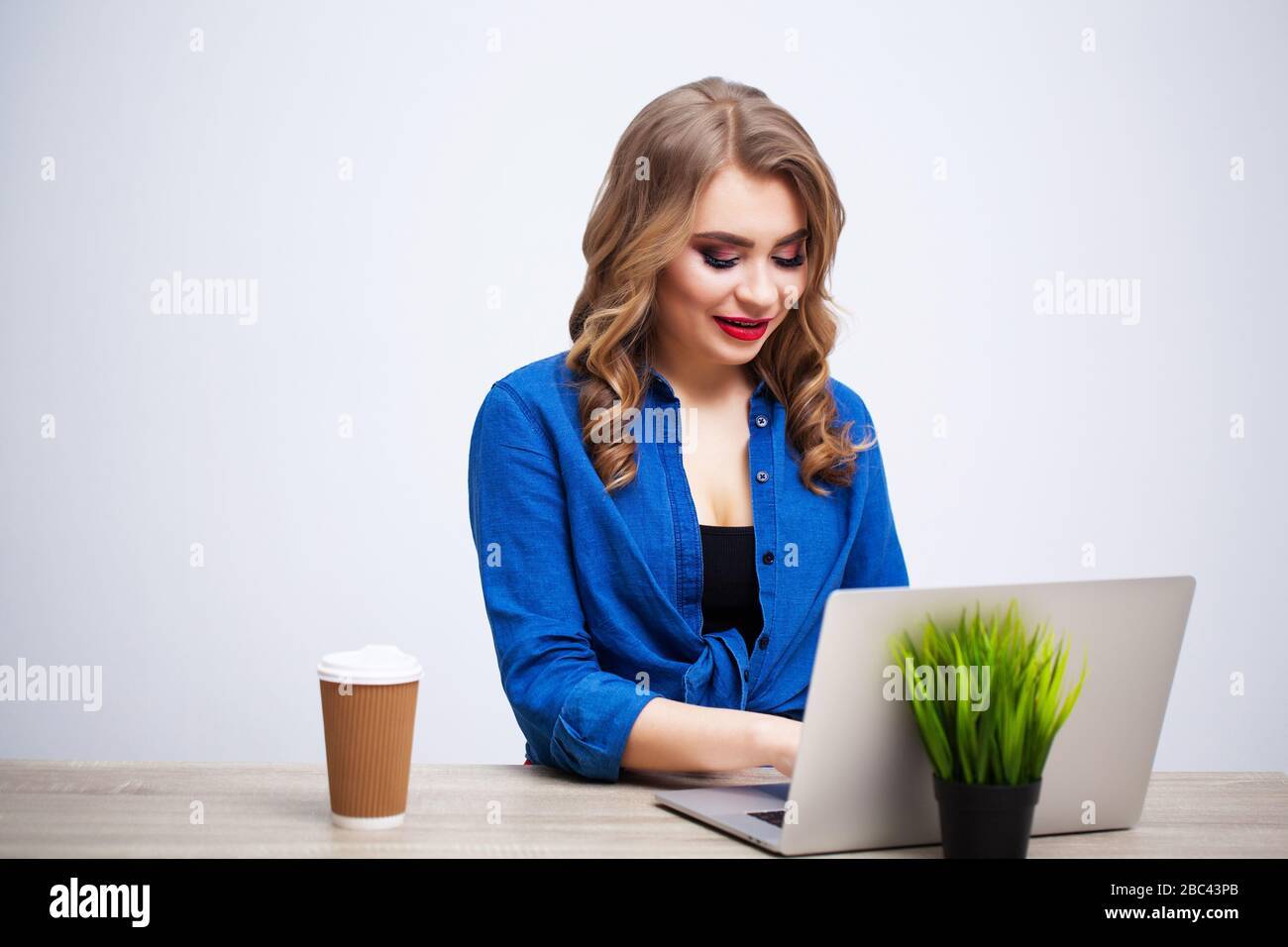 Business woman working at the computer in the office Stock Photo - Alamy