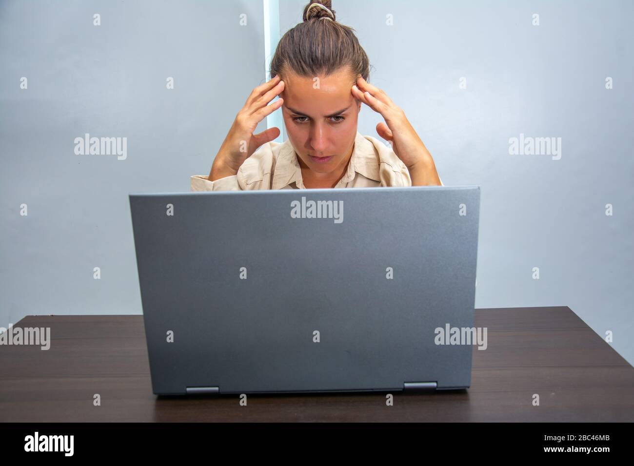 Burnt out female administrative worker at office Stock Photo - Alamy