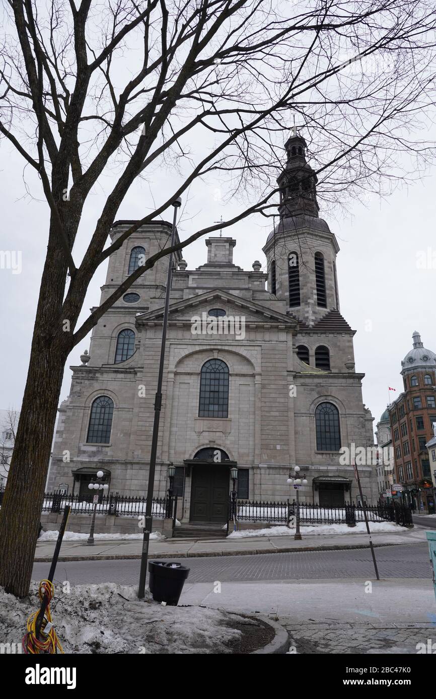 Building in Old Quebec in winter with a tree in front of it Stock Photo ...