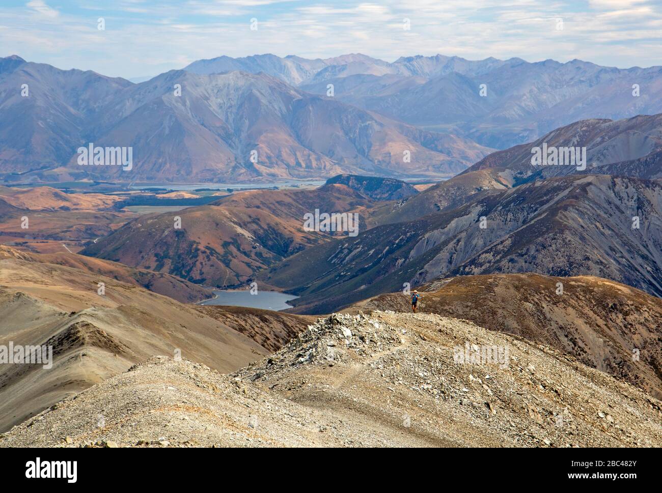 Hiker approaching the summit of Castle Hill Peak Stock Photo - Alamy