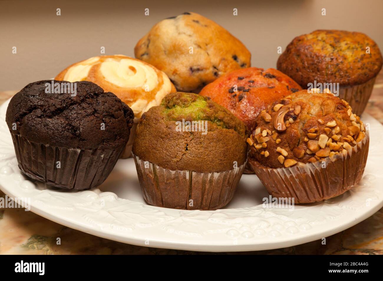 Variety of muffins, including nutty, blueberry, cream cheese, and ...