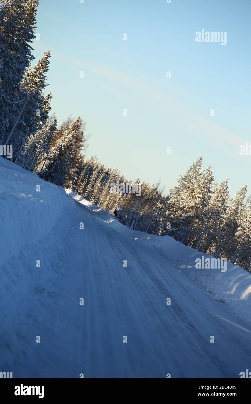 Tilted image of winter road in Sweden Stock Photo - Alamy