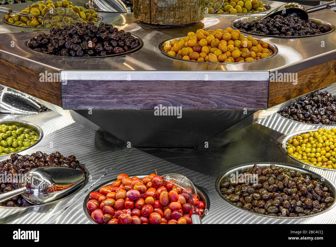 Supermarket olive aisle. Green and black olives in the market Stock ...
