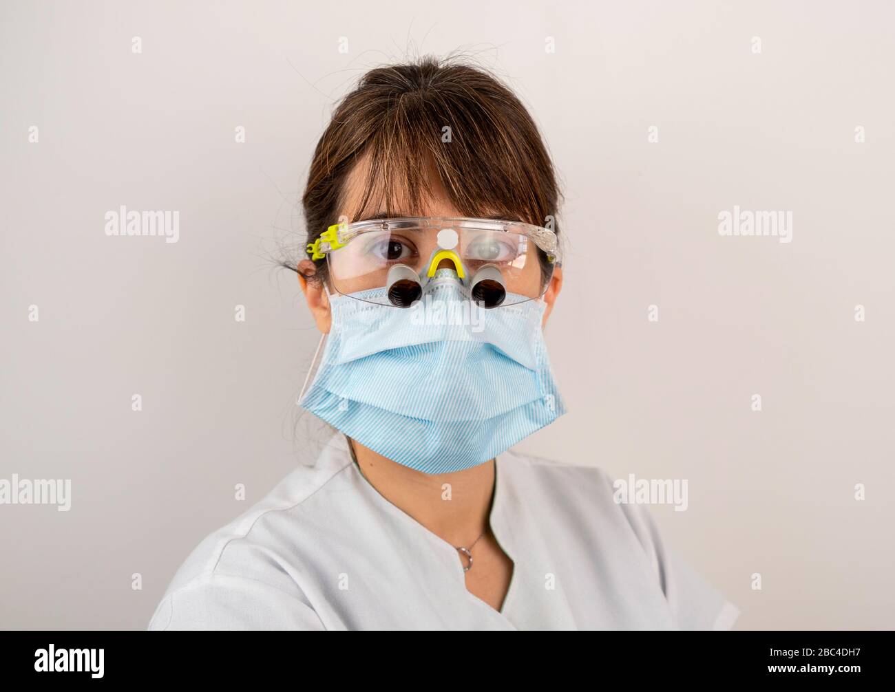 Dentist woman with lab coat with glasses for teeth extraction Stock ...