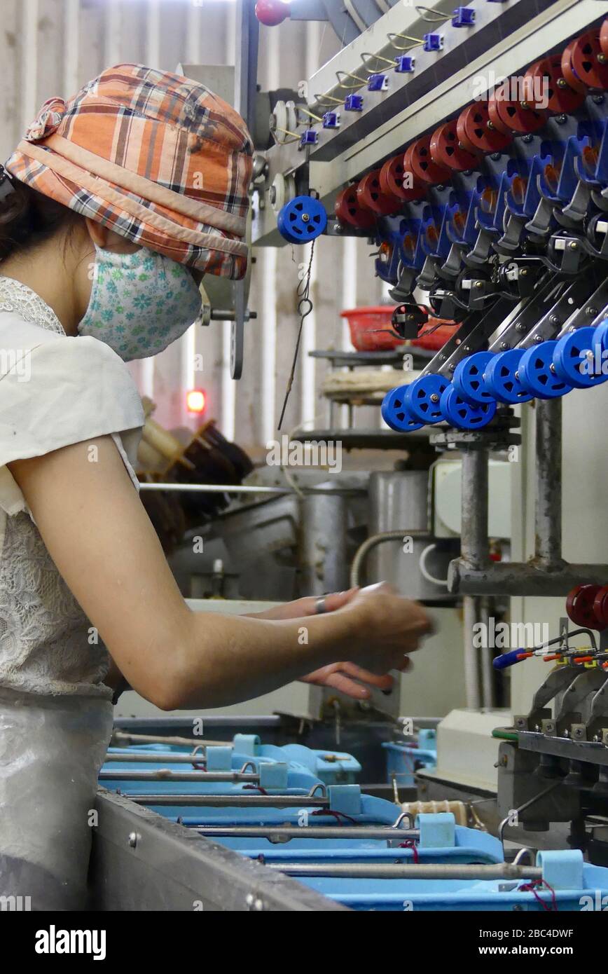 Asian factory worker production line hi-res stock photography and ...