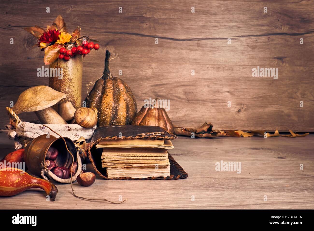 Autumn Thanksgiving arrangement with wooden mushrooms. Fall leaves ...