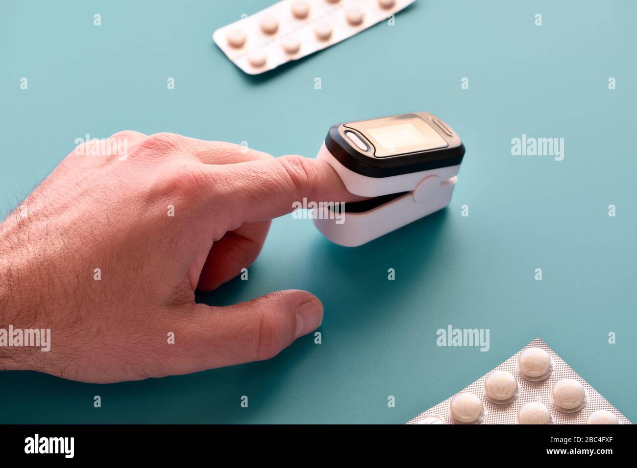 Measuring persons pulse oxygen saturation hi-res stock photography and ...