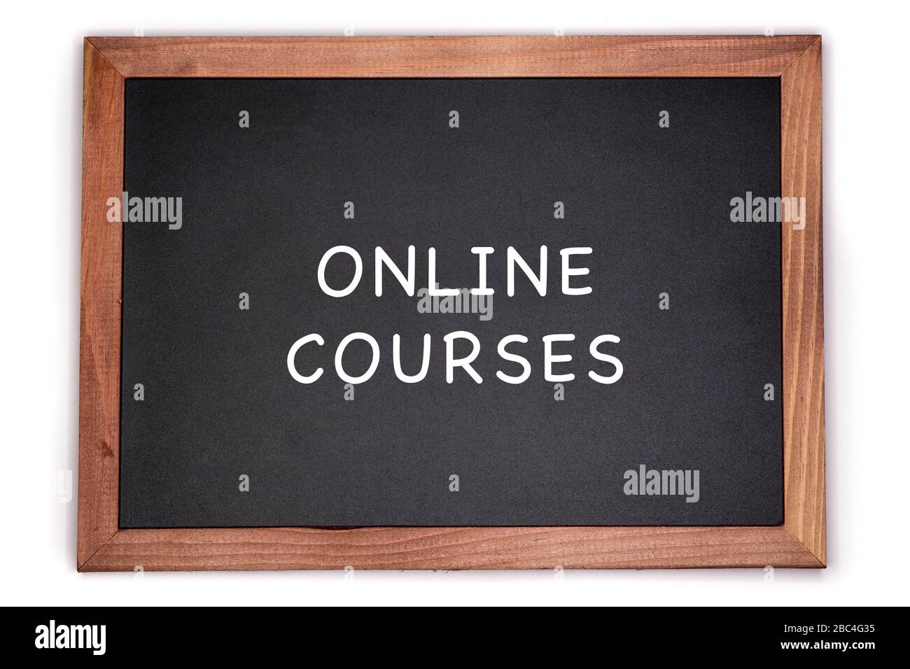 Online courses written on chalkboard, white background Stock Photo - Alamy