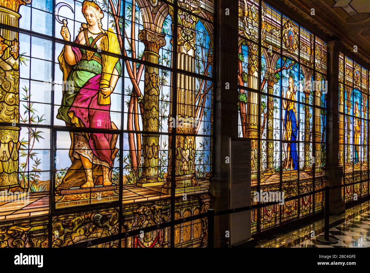 Hallway lined with ornate stain glass murals, at Chapultepec Castle, in ...