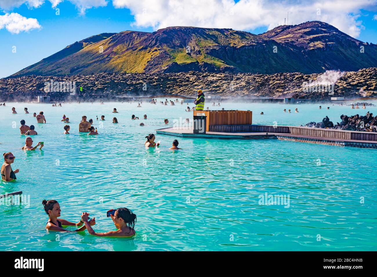 People enjoying the warmth and relaxation of the Blue Lagoon geothermal ...