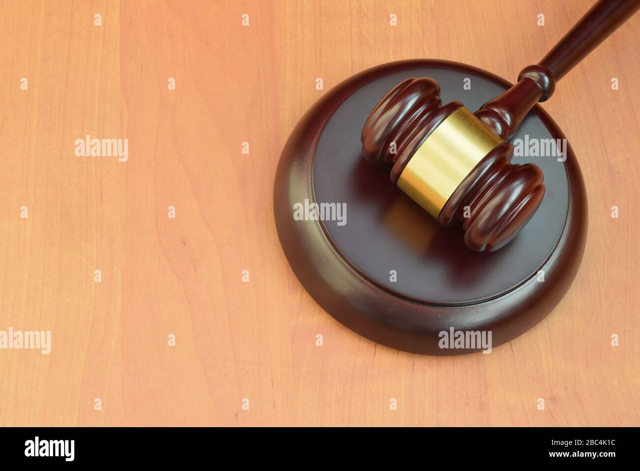 Justice mallet on wooden desk in a courtroom during a judicial trial. Law concept and empty copy ...