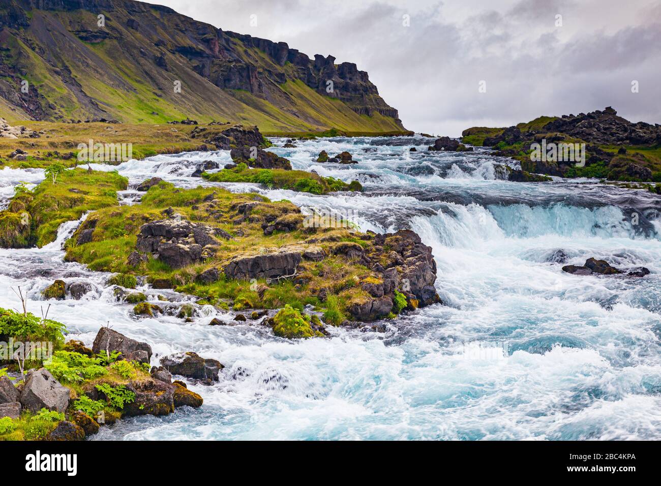 Fast flowing river parallel to the main south coastal highway in ...