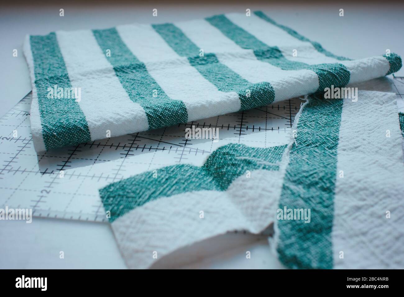 sewing a pleated cloth mask upcycled from a green and white striped ...