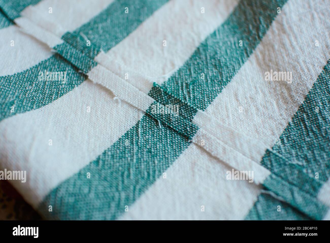 sewing a pleated cloth mask upcycled from a green and white striped ...