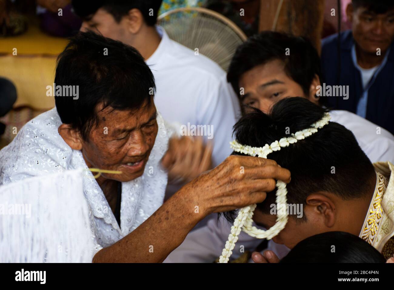 YASOTHON, THAILAND - JANUARY 12 : Thai relatives and friends join and ...