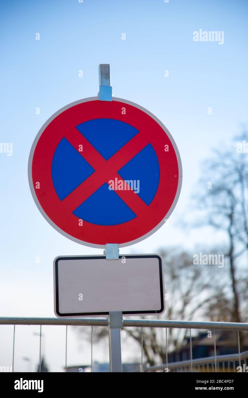 Traffic sign in red and blue with additional sign in white, indicating ...