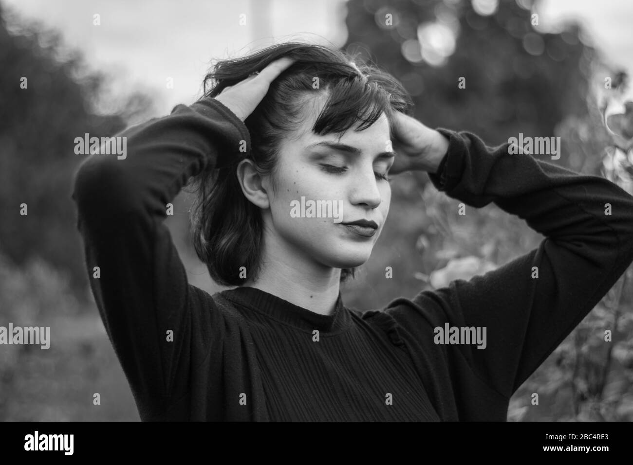 Emotional woman enjoying the sunset outdoors Stock Photo - Alamy