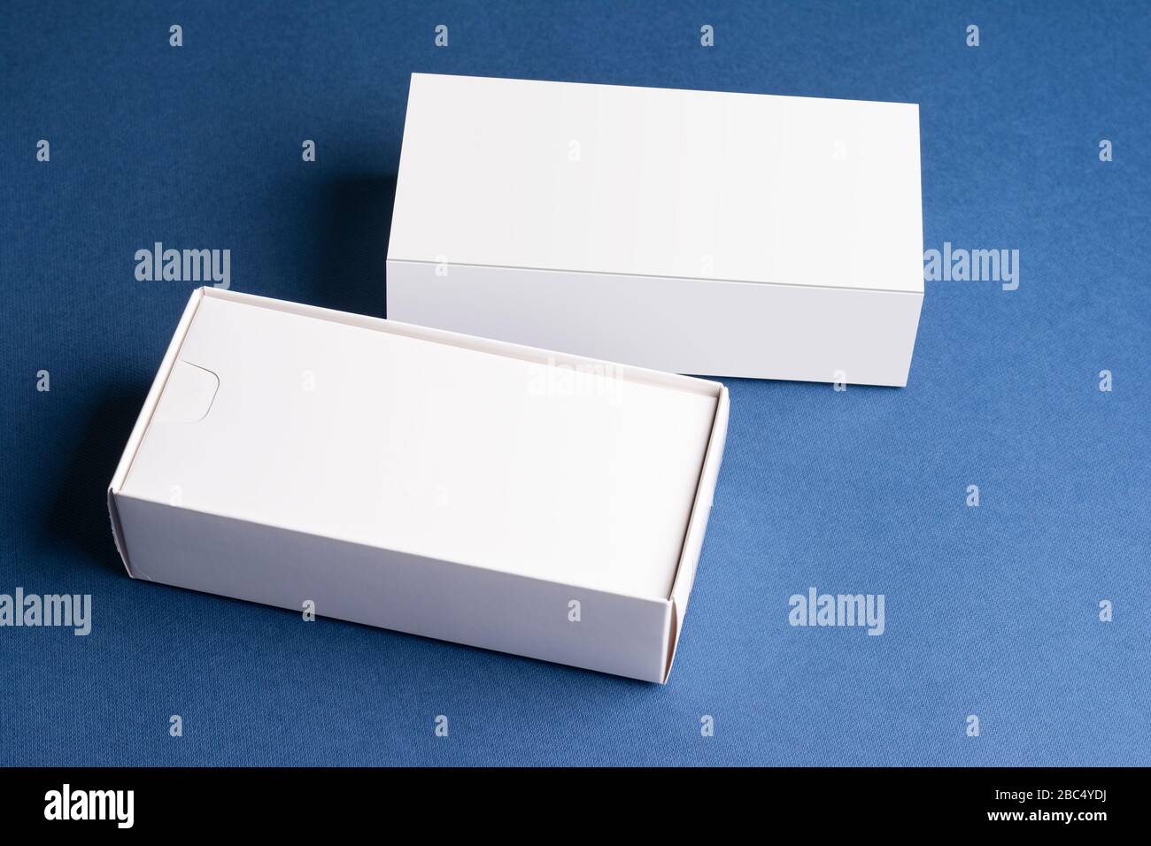 Smartphone's pull out boxes on blue surface, editable mock up template ...