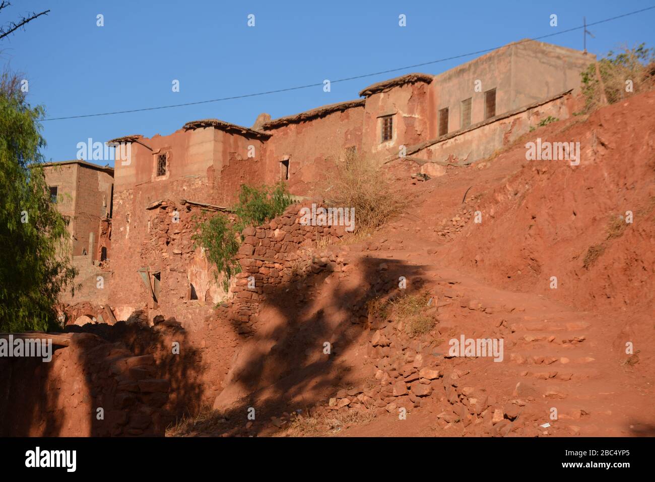 A dirt pathway leads up into an Amazigh Berber village near Asni in ...