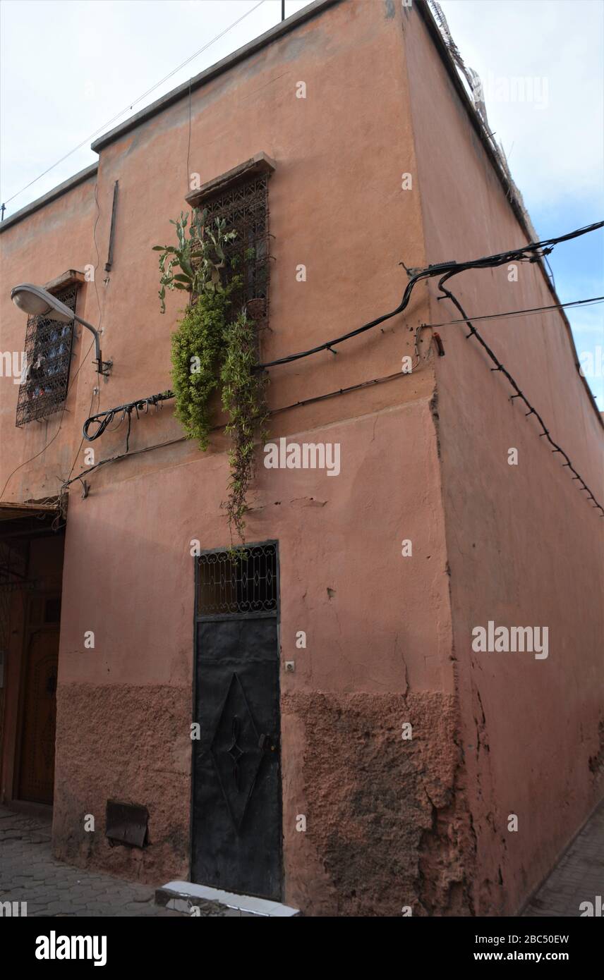 Exterior of a traditional old home on the corner of a narrow street in ...