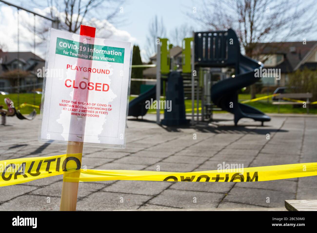 A playground closed sign due to COVID-19 prevention measures infront of ...