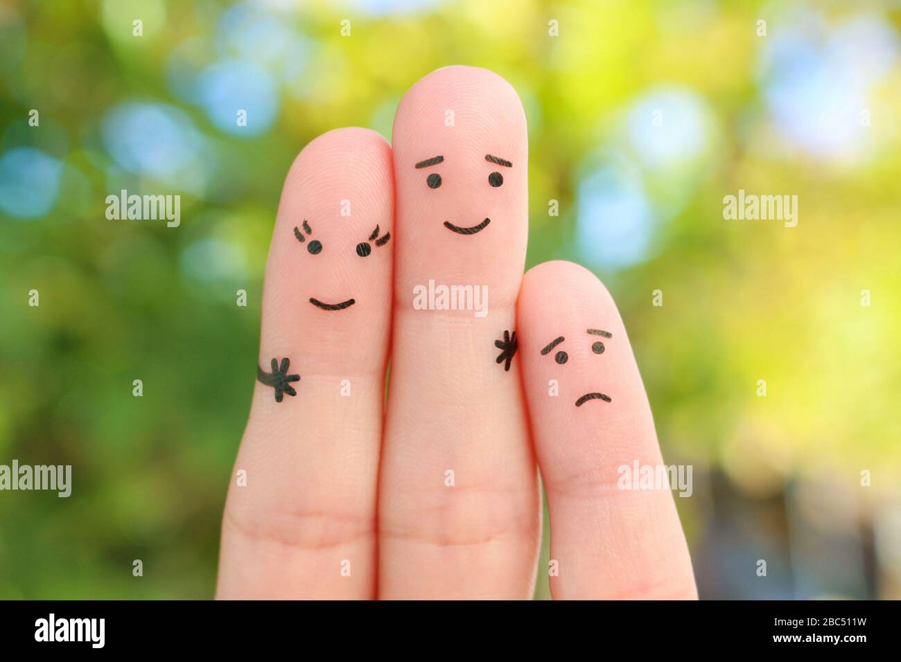Fingers art of happy couple. Child is angry Stock Photo - Alamy