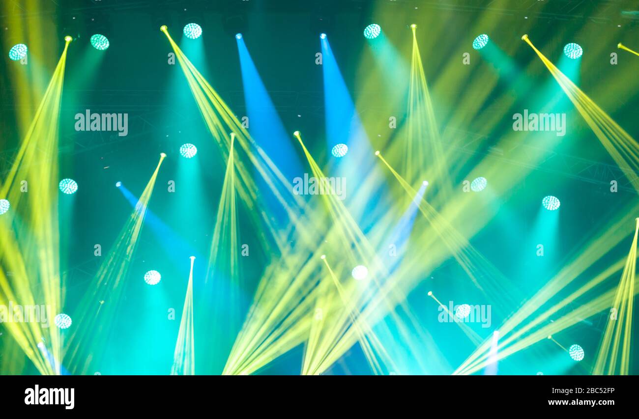 Stage lights on concert. Lighting equipment with multi-colored beams ...