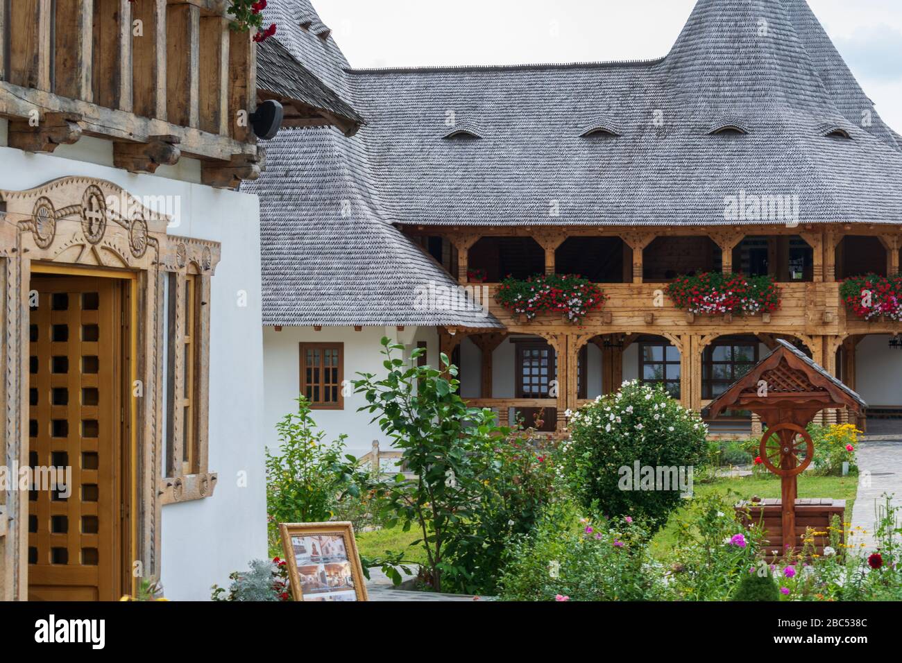 Wooden buildings in the courtyard of Barsana Monastery, Romania Stock ...