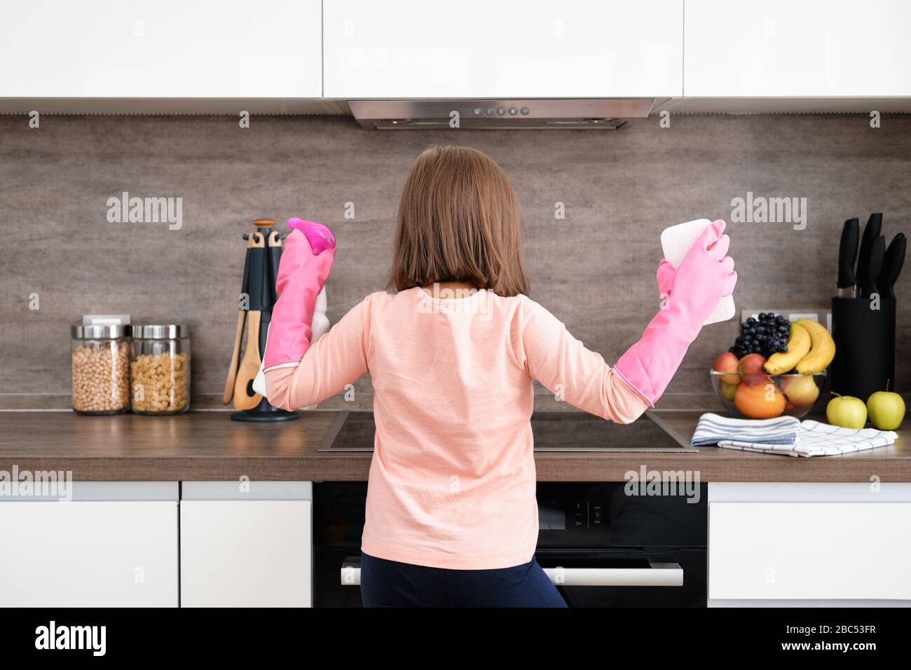 Preschool Girl doing Cleaning Kitchen. House cleaning Stock Photo - Alamy