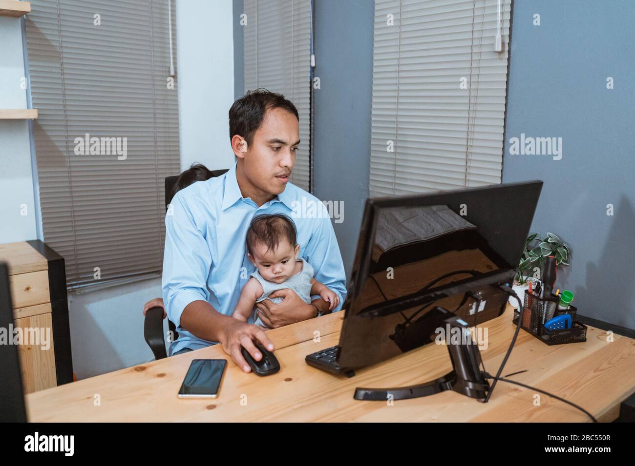 Man babysitting young girl hi-res stock photography and images - Alamy