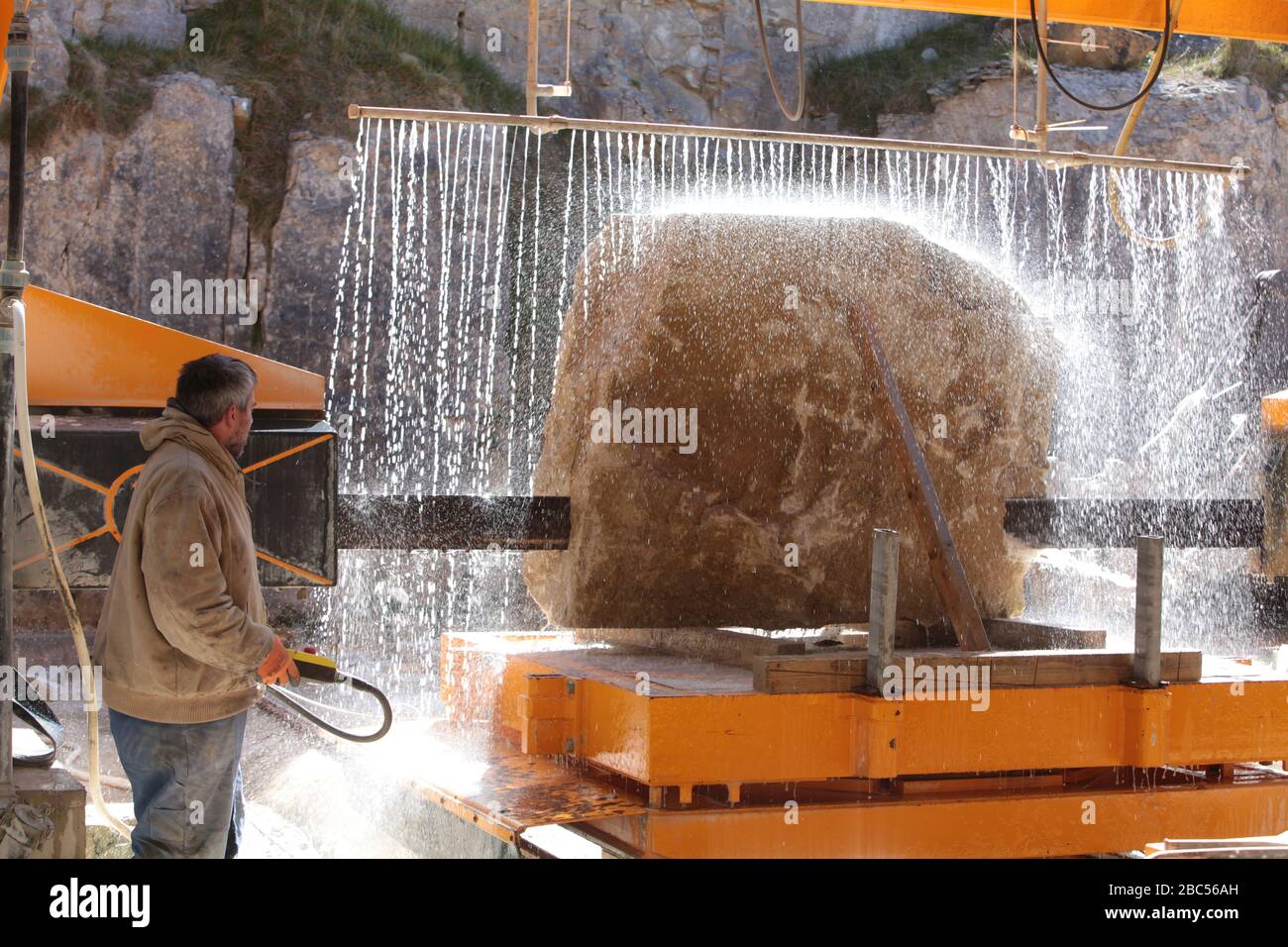 Corvid 19 - Stone Mason Justin Warren cuts a recently quarried purbeck ...