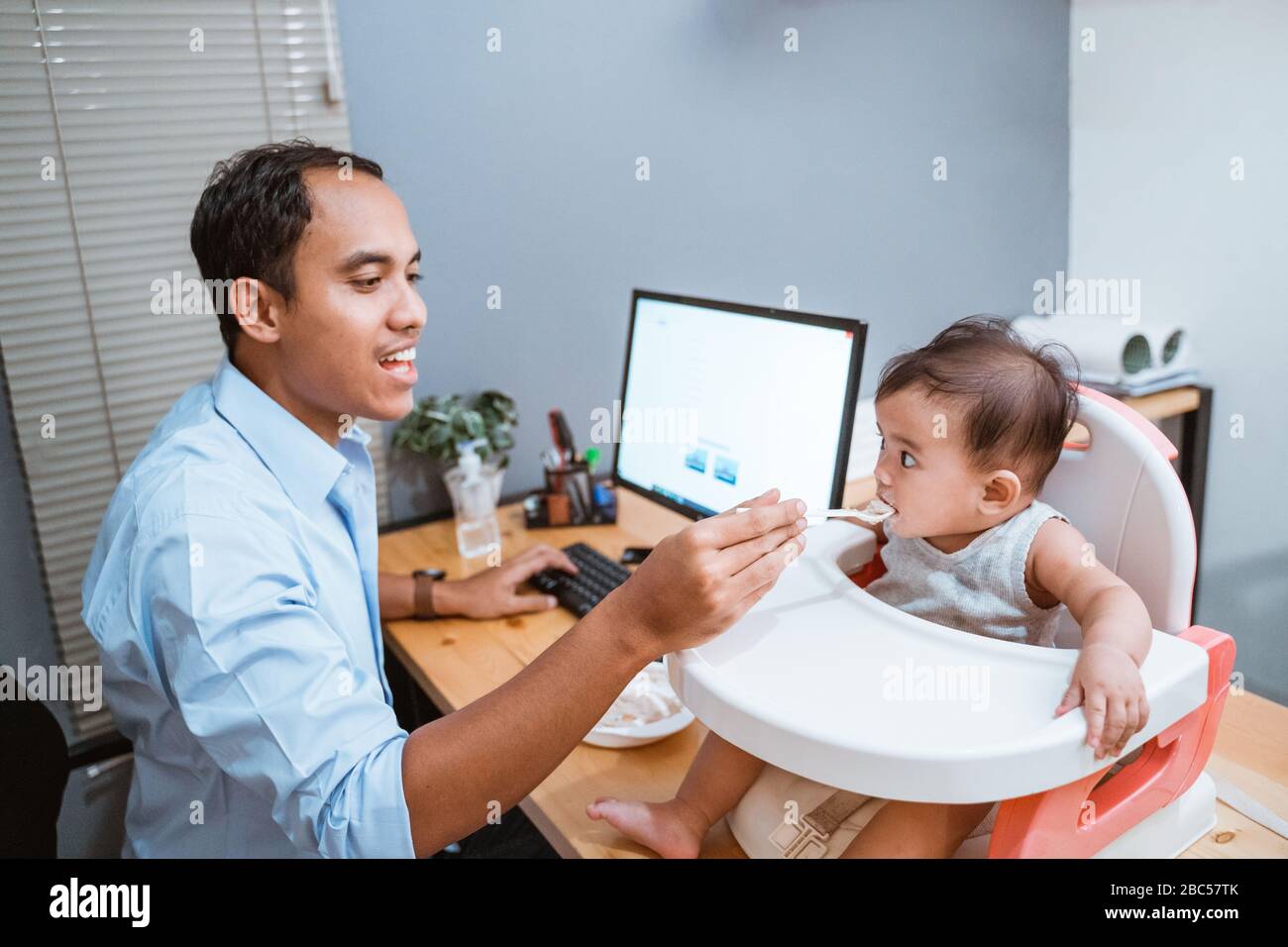 Man multitasking child hi-res stock photography and images - Alamy