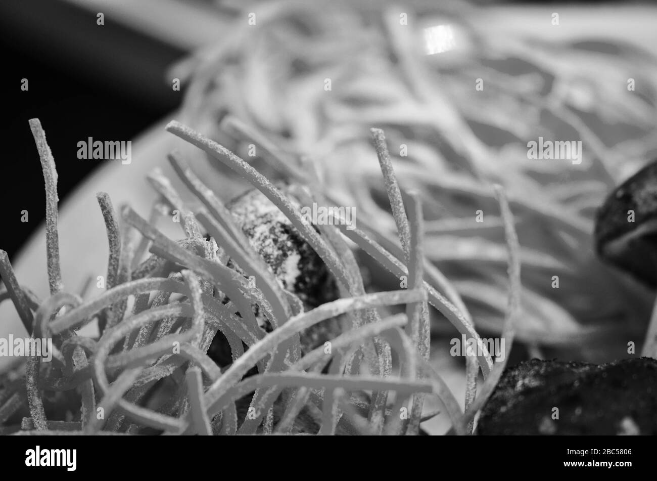 Preparing pasta dinner Black and White Stock Photos & Images - Alamy