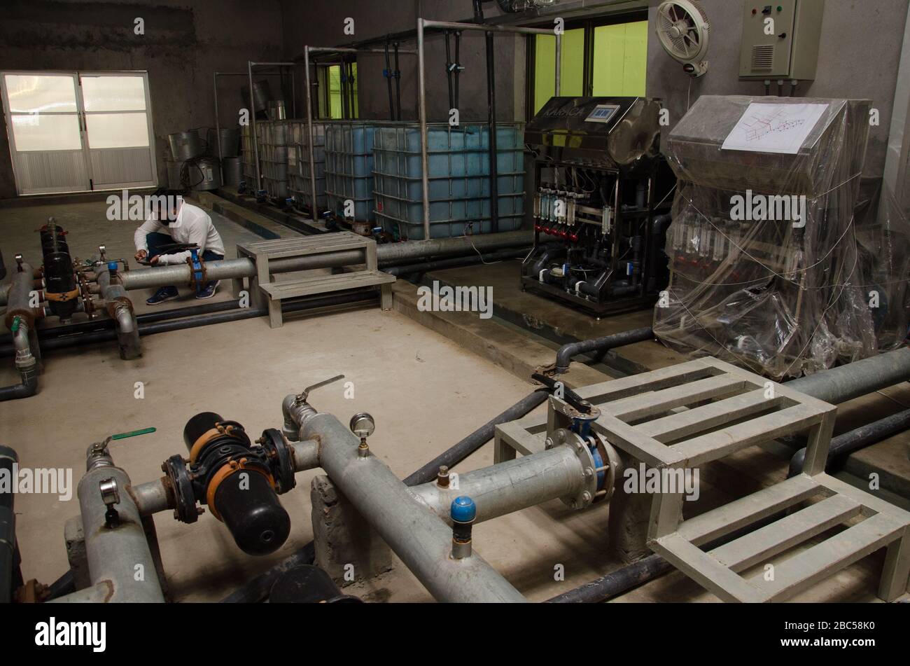 An engineer operates the drip irrigation plant at MA Agri Farm in ...