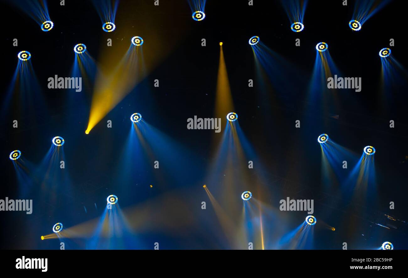 Stage lights on concert. Lighting equipment with multi-colored beams ...