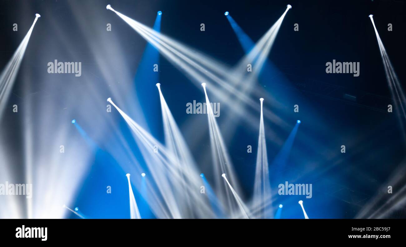 Stage lights on concert. Lighting equipment with multi-colored beams ...