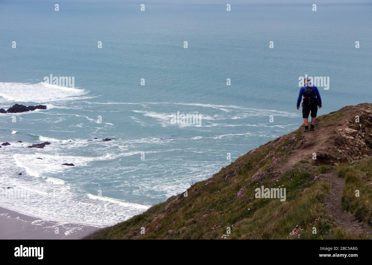 Lone Man Hiker Walking on the Cliff Edge at Steeple Point above ...
