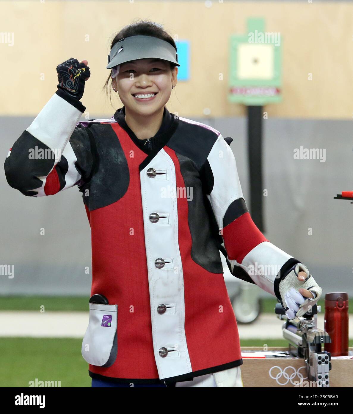 China's Siling Yi celebrates winning 10m Air Rifle Final at the Royal ...