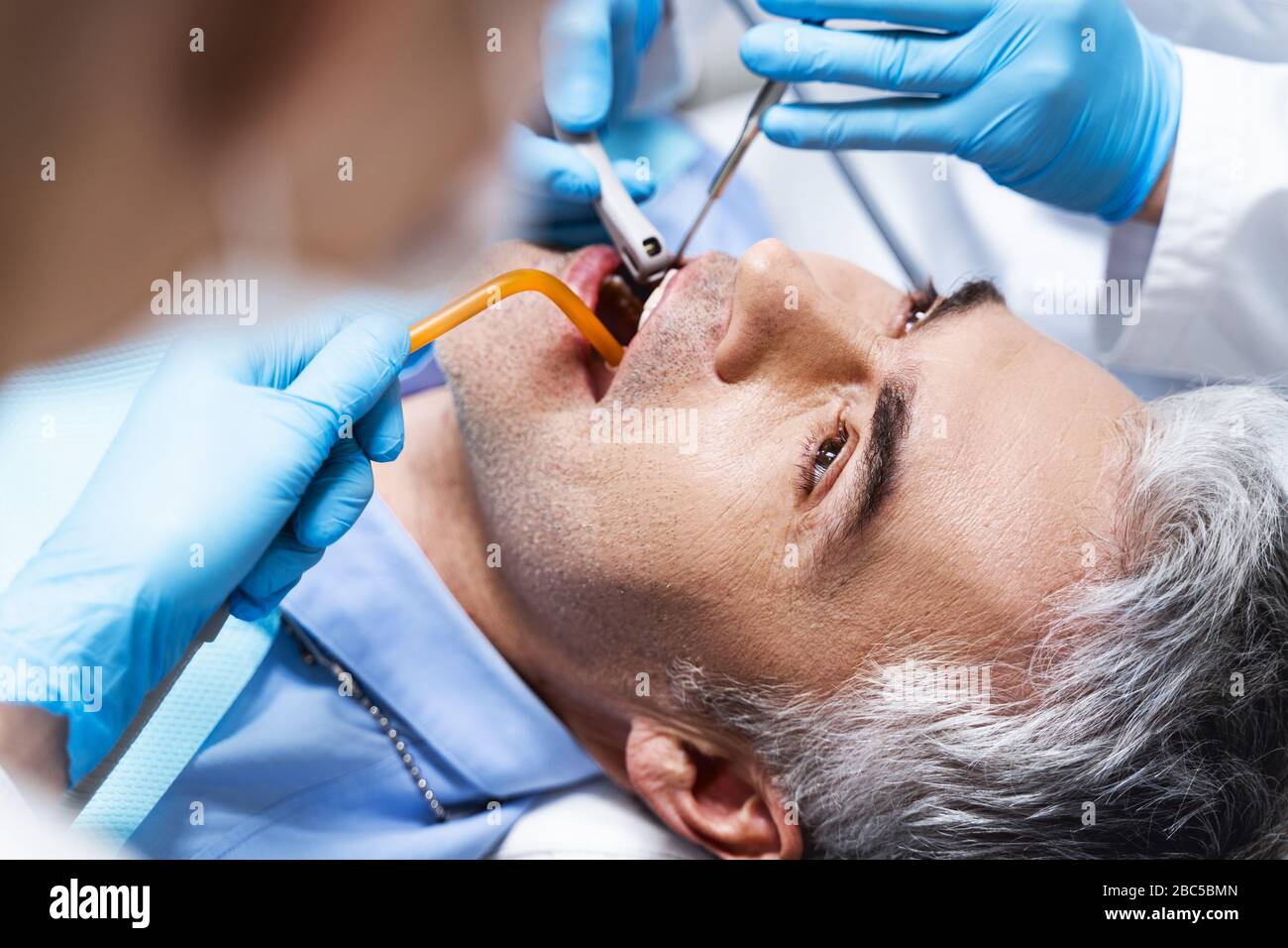Man is having teeth cured stock photo Stock Photo - Alamy