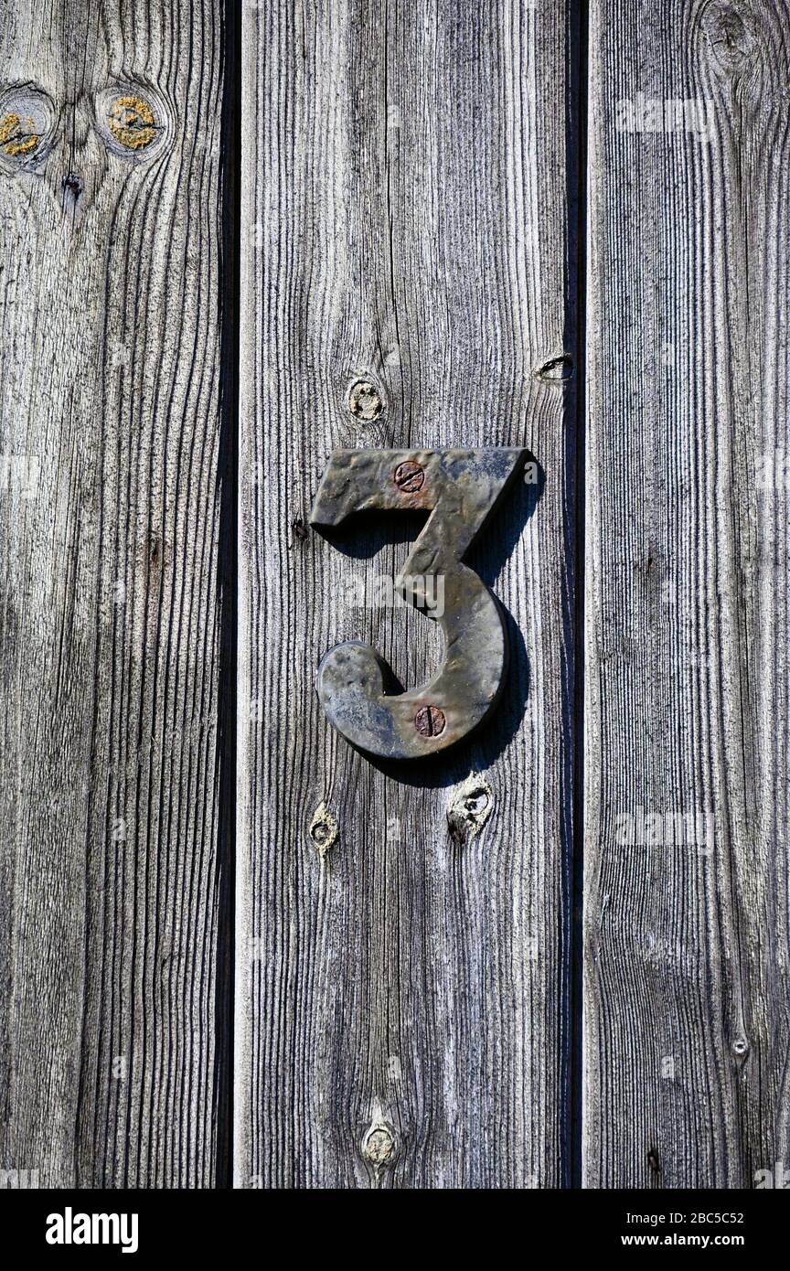Number 3 on old wooden gate. Fellside, Kendal, Cumbria, England, United ...