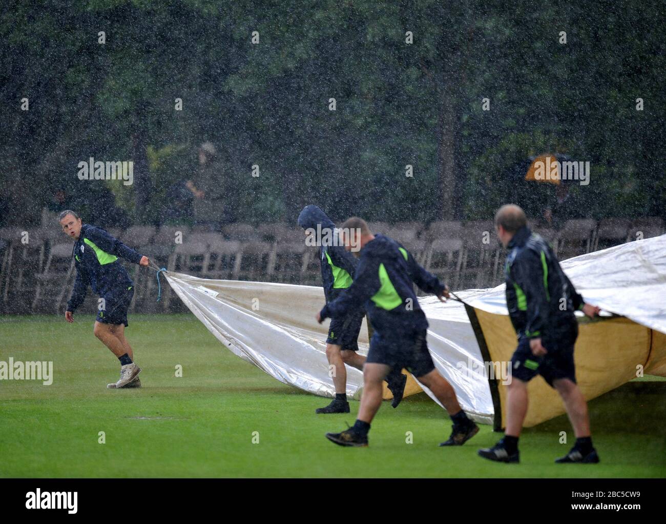 A sudden burst of rain put a stop to play just before lunch Stock Photo ...