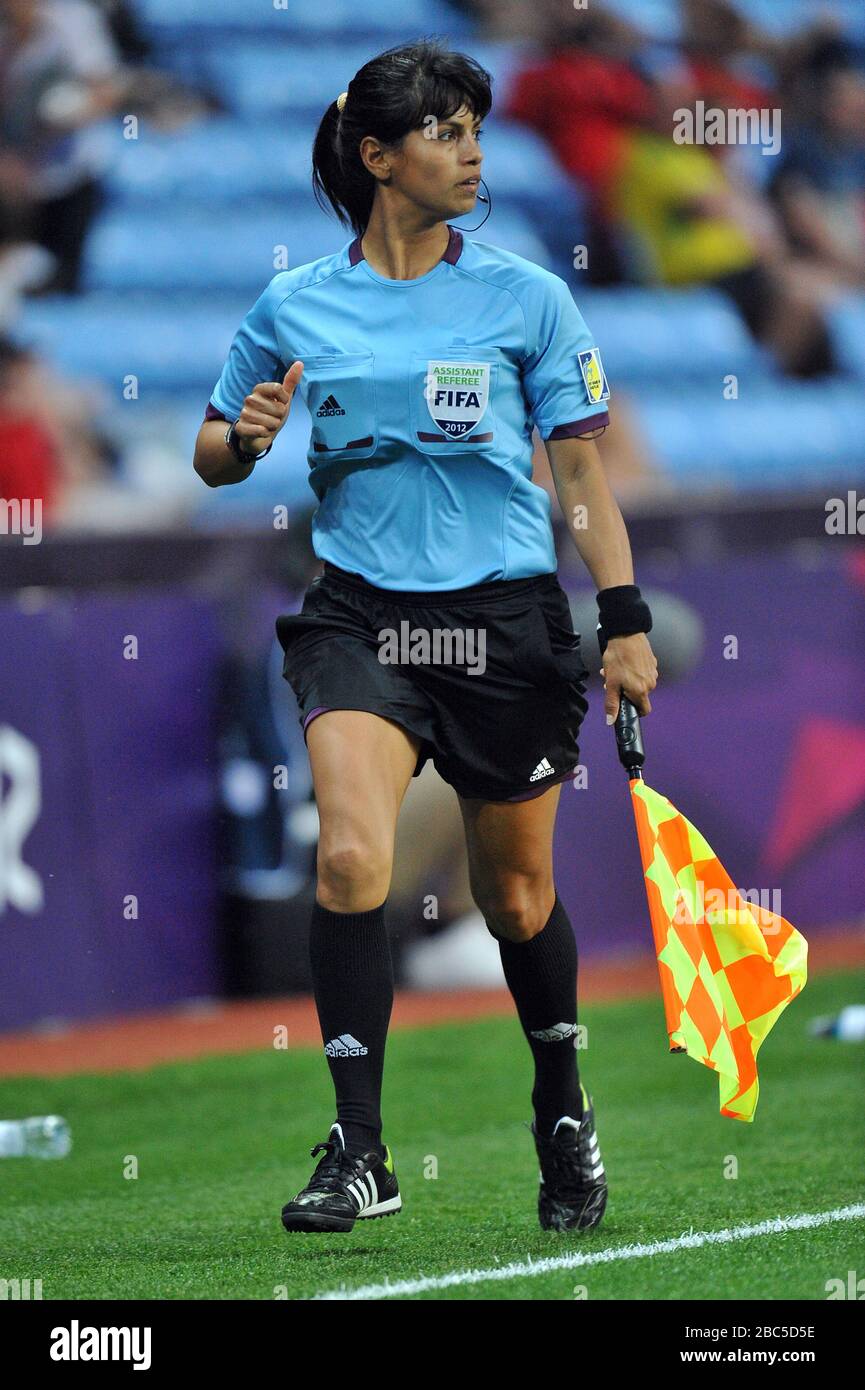 An assistant referee runs the line during the Sweden v South Africa ...