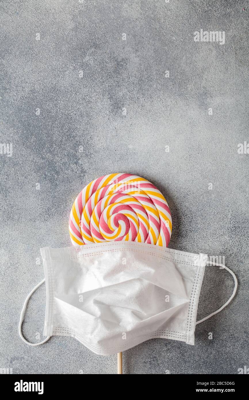 multi colored lollipop covered medical mask top view flat lay copy ...