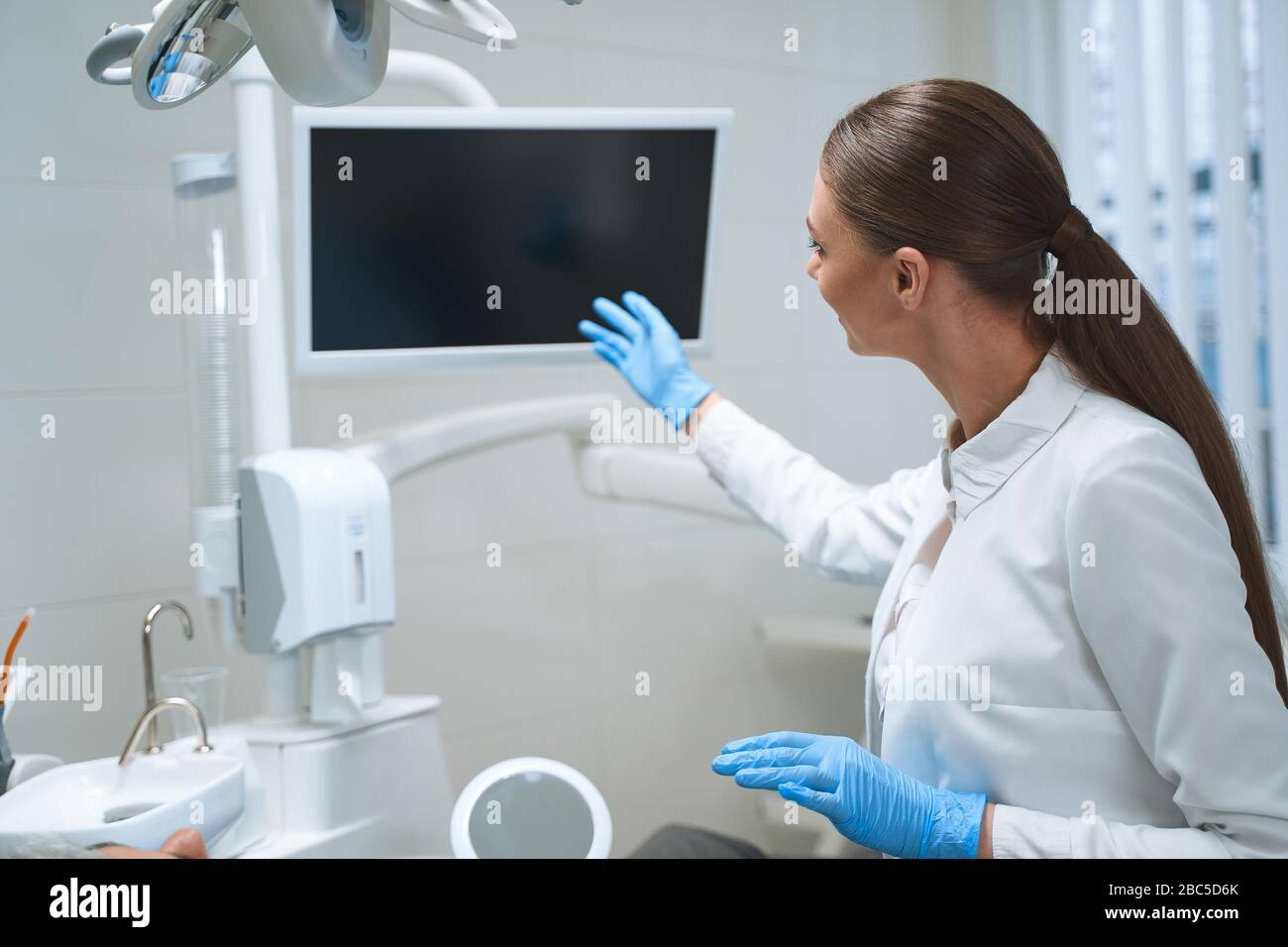 Dentist using digital screen during consultation stock photo Stock ...