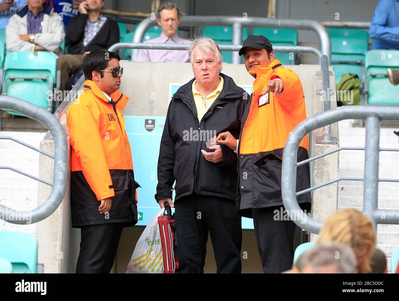Stewards help people to their seats Stock Photo - Alamy