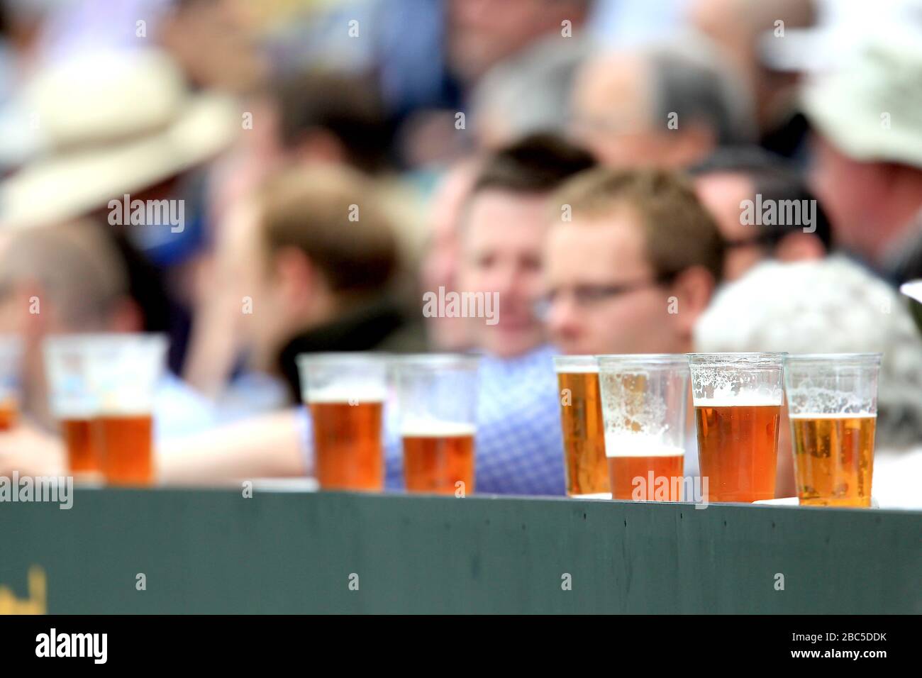 Glasses of beer perched on the hoarding hi-res stock photography and ...