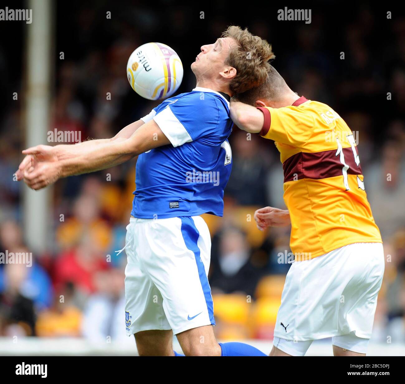 Everton's Nikica Jelavic in action with Motherwell's Simon Ramsden ...