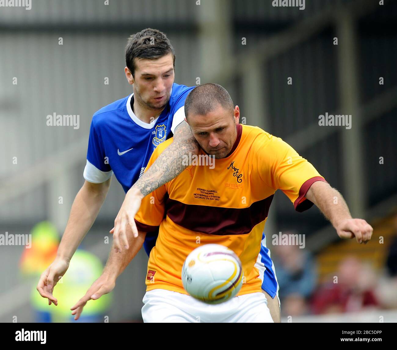 Everton's Shane Duffy and Michael Higdon (right) battle for the ball ...
